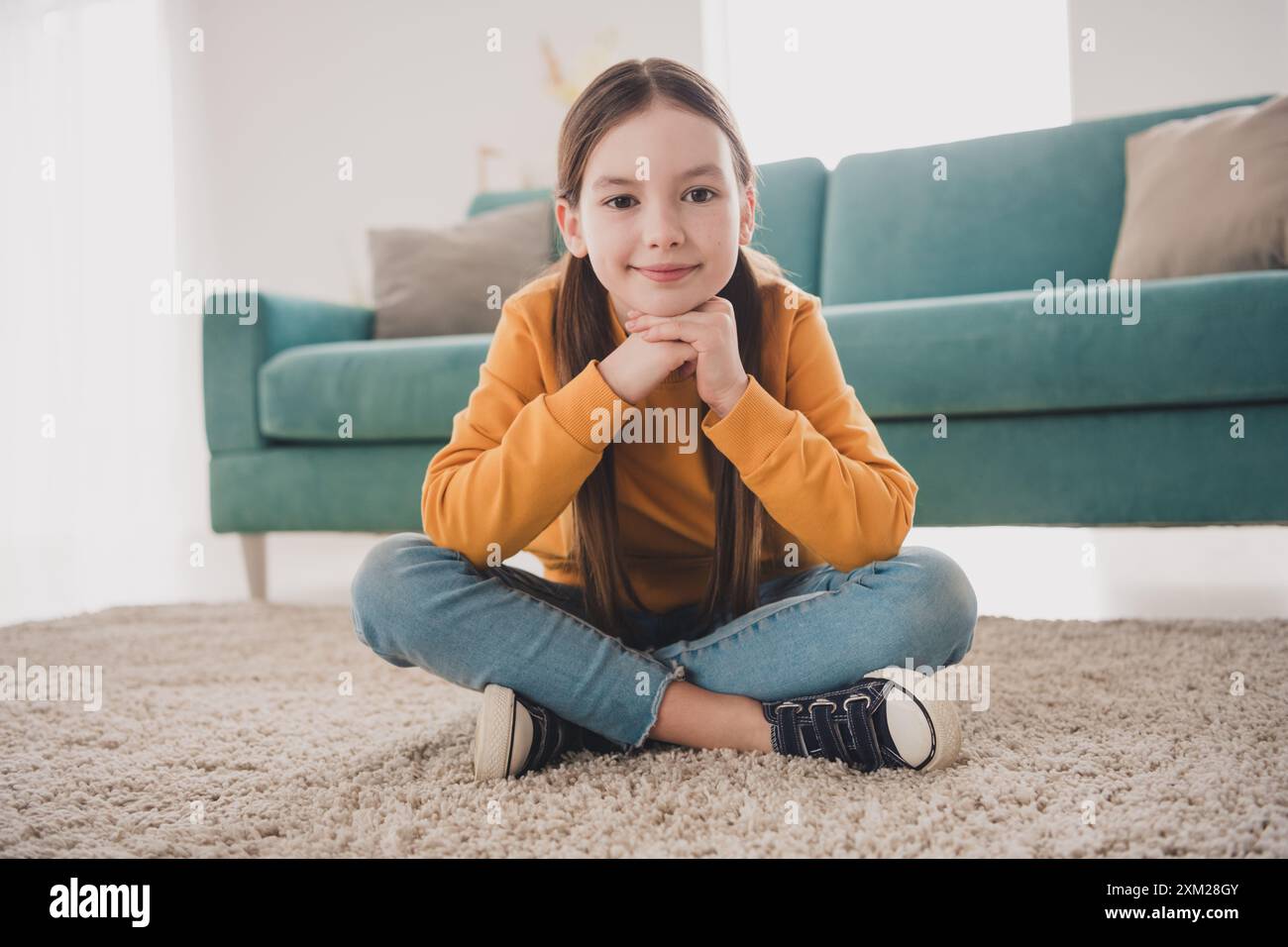 Full size photo of cute little girl wear sweater sitting floor chill ...