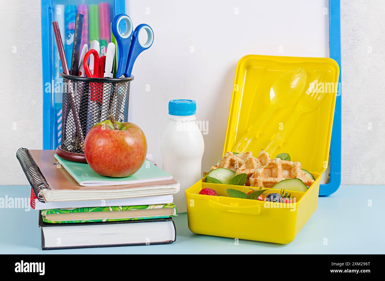 Kids lunch box with zucchini waffles, cucumber, cherry tomatoes and ...