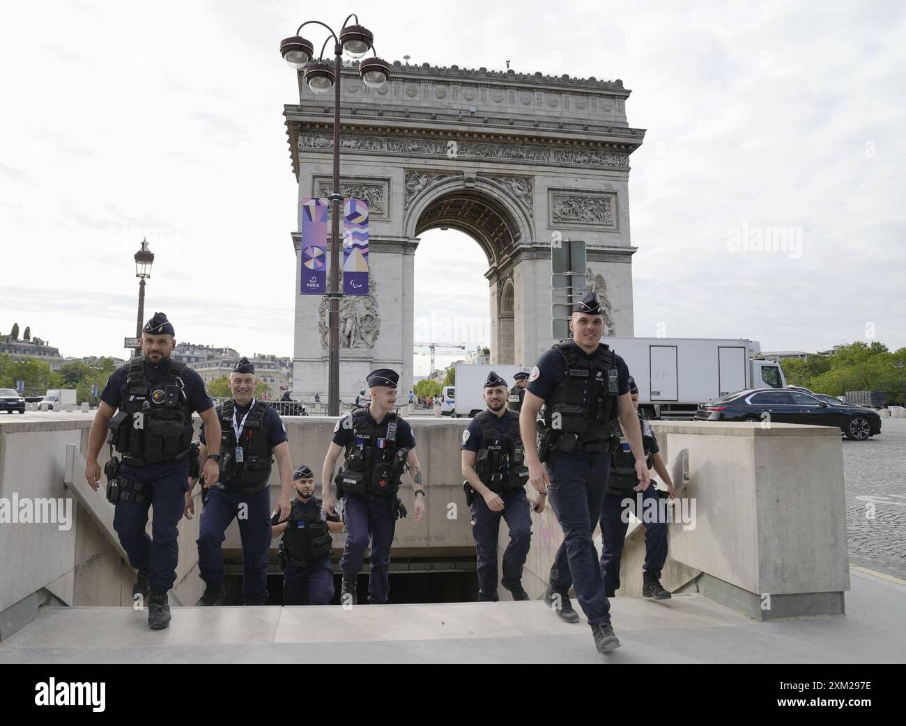 Police officers patrol near the Arc de Triomphe in Paris on July 25 ...