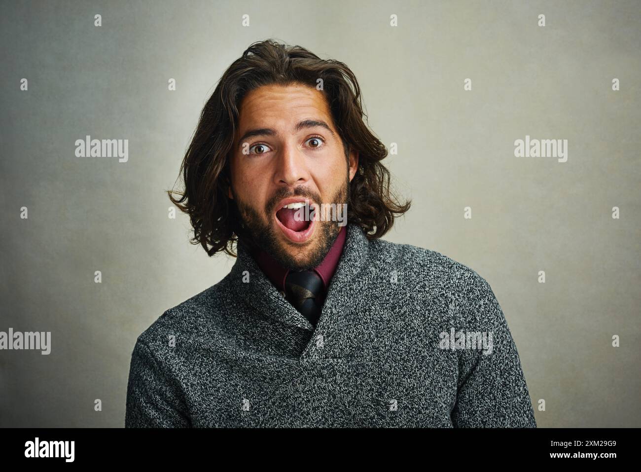 Man, portrait and shock reaction in studio for gossip secret ...