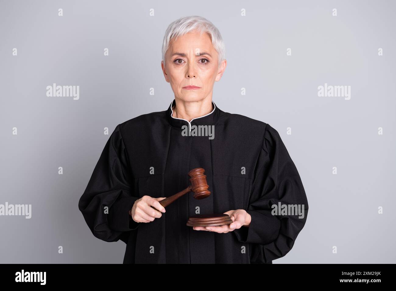 Photo of serious judge woman knock gavel having court verdict wear robe ...