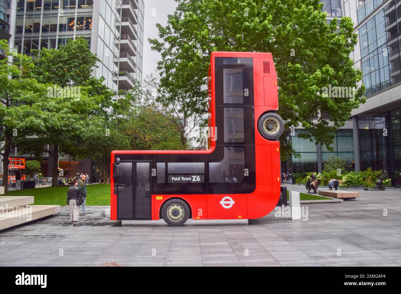 London, UK. 25th July 2024. A life-size folded bus at Spitalfields ...