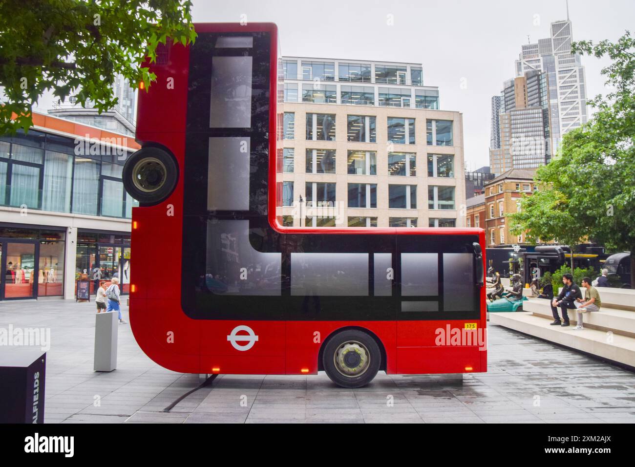 London, UK. 25th July 2024. A life-size folded bus at Spitalfields ...