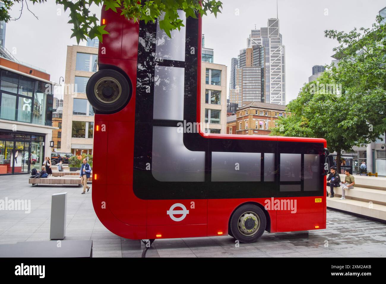 London, UK. 25th July 2024. A life-size folded bus at Spitalfields ...
