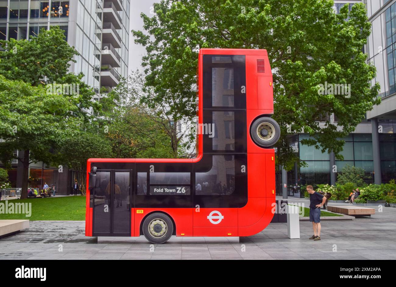London, UK. 25th July 2024. A life-size folded bus at Spitalfields ...