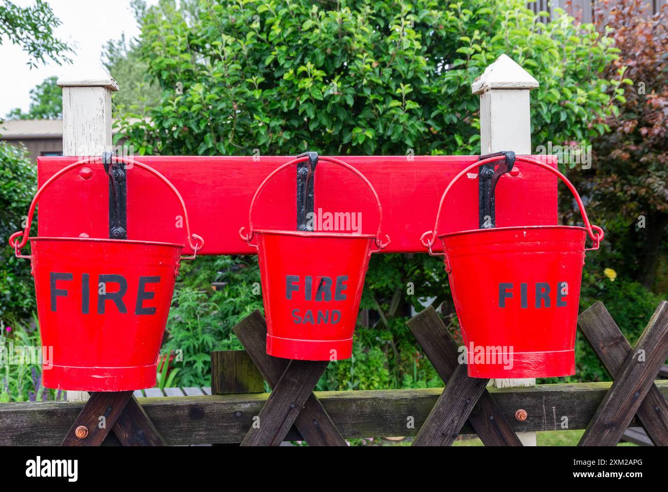 3 vintage fire buckets hanging up at Weybourne train station, part of ...