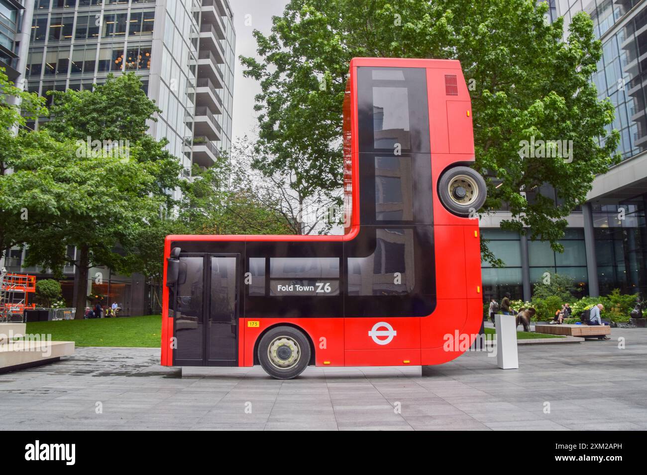 London, UK. 25th July 2024. A life-size folded bus at Spitalfields ...