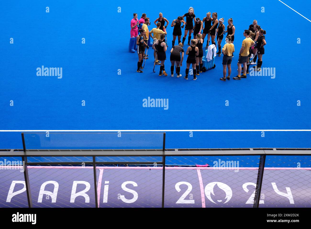 Members of the women's hockey team from Germany huddle, during a ...