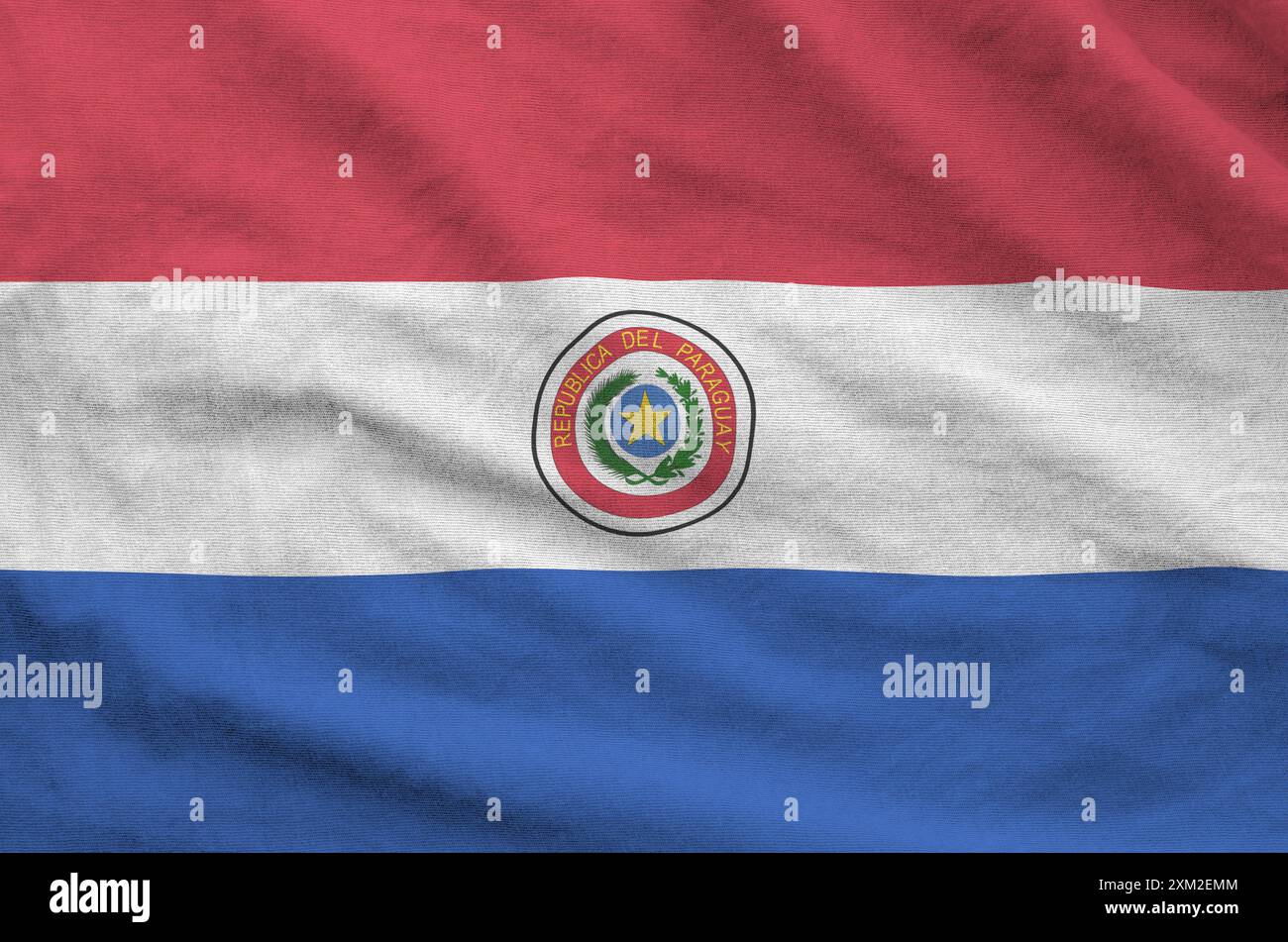 Paraguay flag depicted on folded wavy fabric of old cloth close up ...