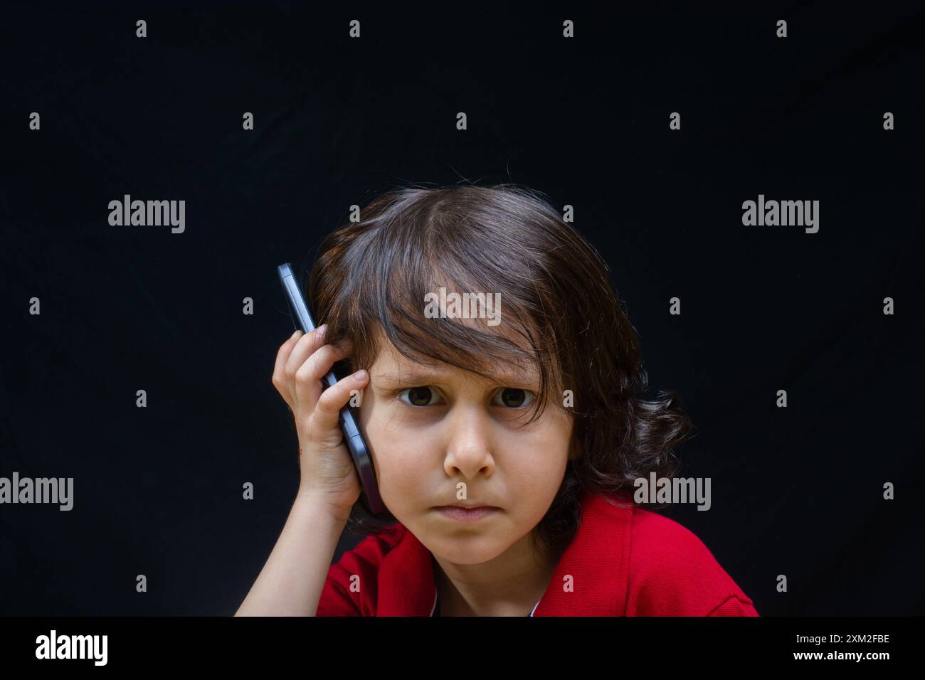 Little boy hold smartphone as modern mobile communication gadget Stock ...