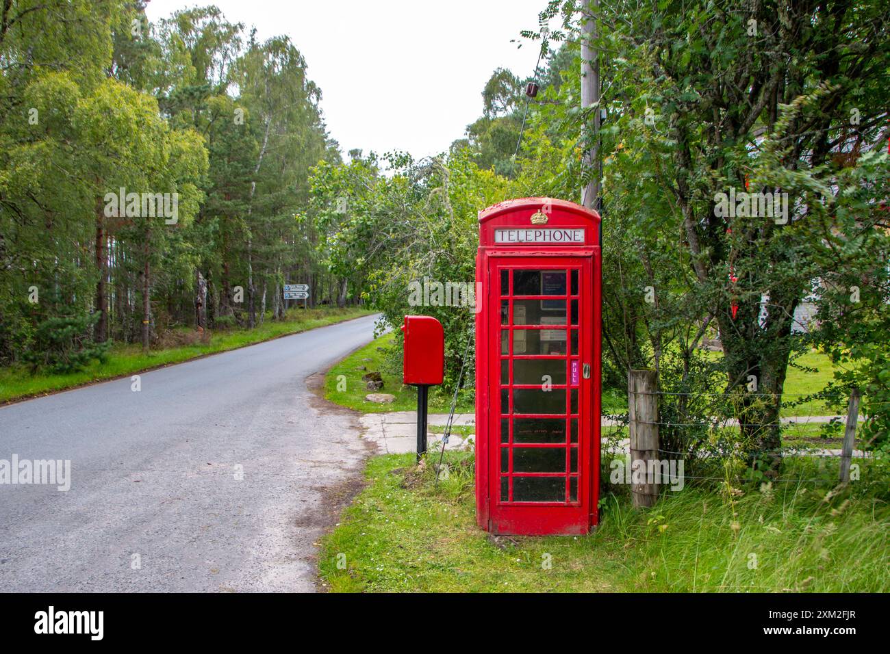 Scotland, United Kingdom - July 18 2024: famous red public payphone box ...