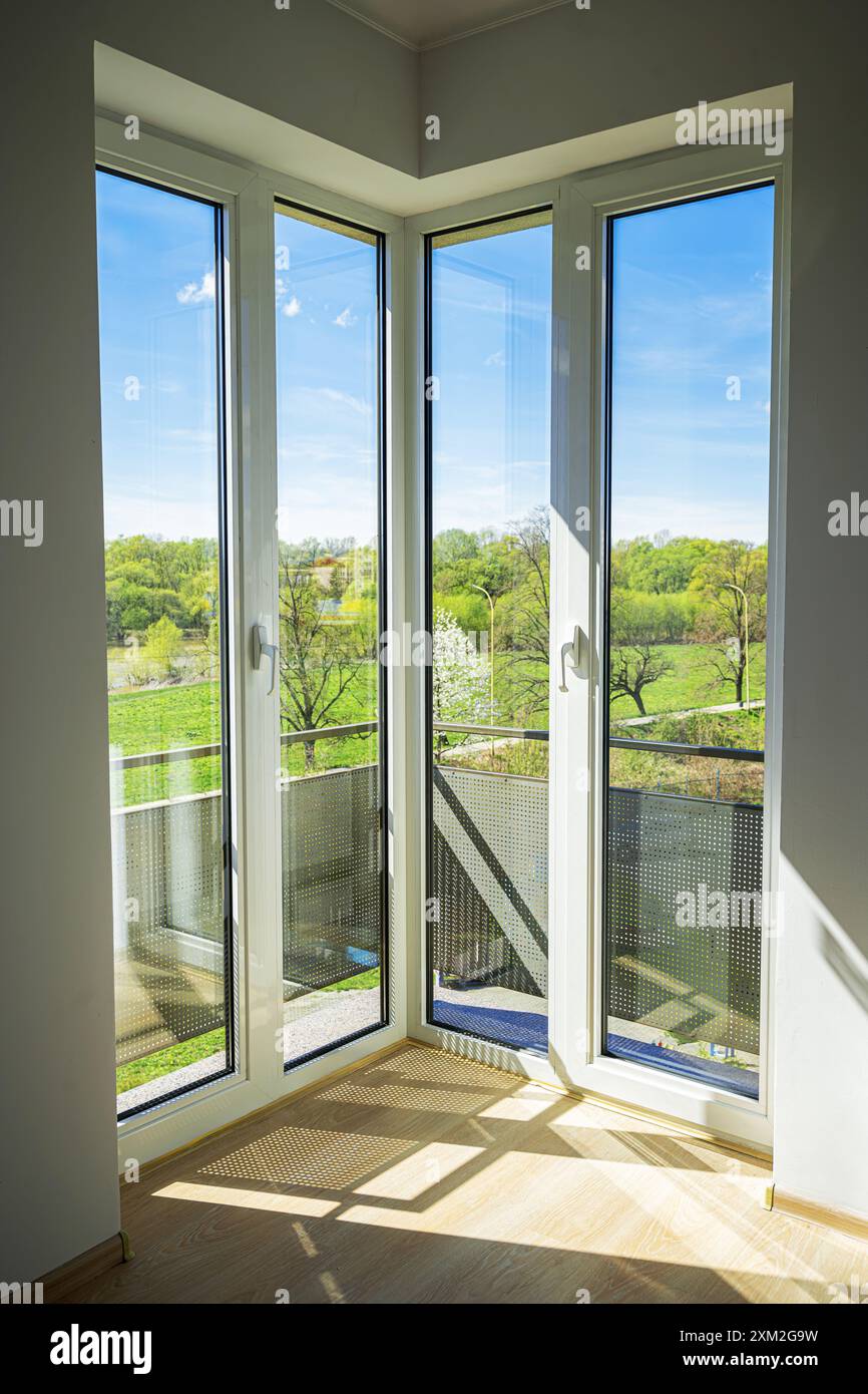 Corner window to the floor in the living room Stock Photo - Alamy