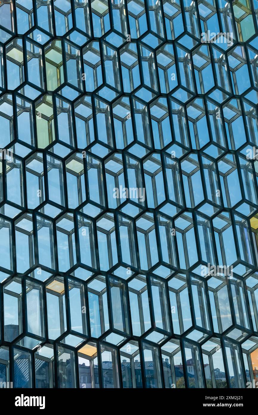 Geometric glass facade of modern building with honeycomb pattern ...