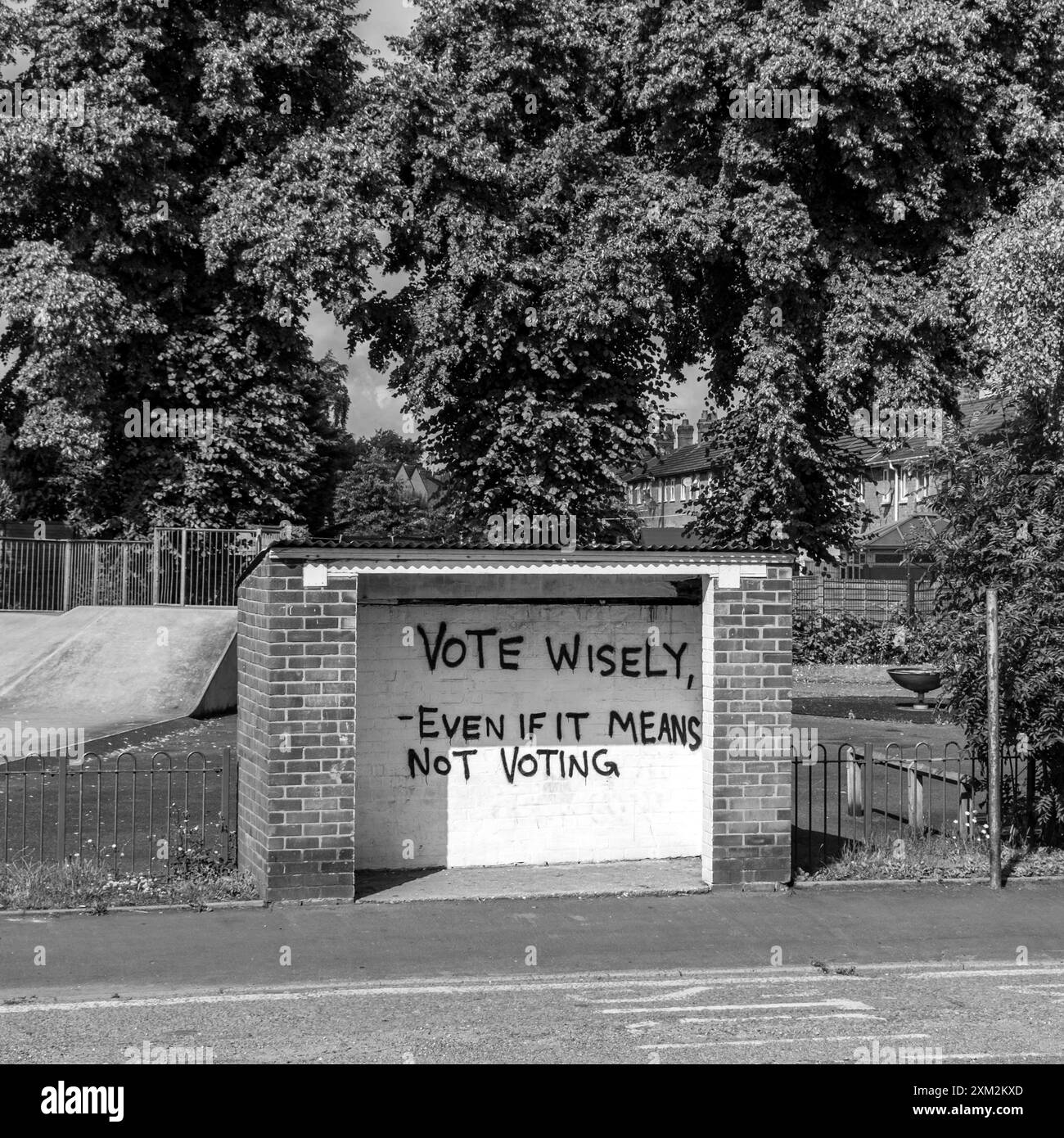 Black & white, vote wisely, voting advice painted in bus stop UK Stock ...