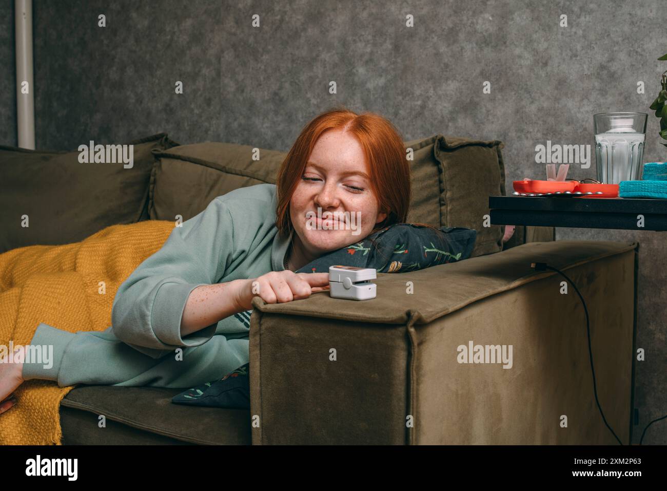 self-care and vigilance is portrayed as a woman checks her oxygen ...
