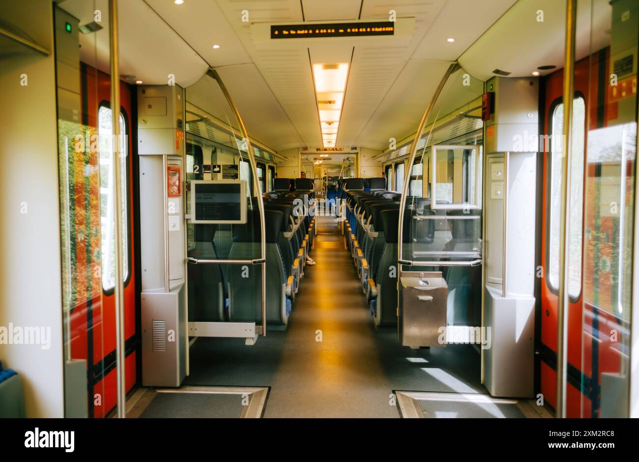 Interior detail of German regional train, large windows and empty seats ...