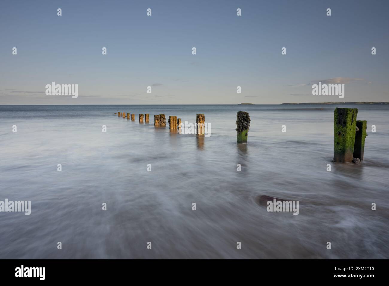 Youghal Strand Groynes on a warm summer evening Stock Photo - Alamy