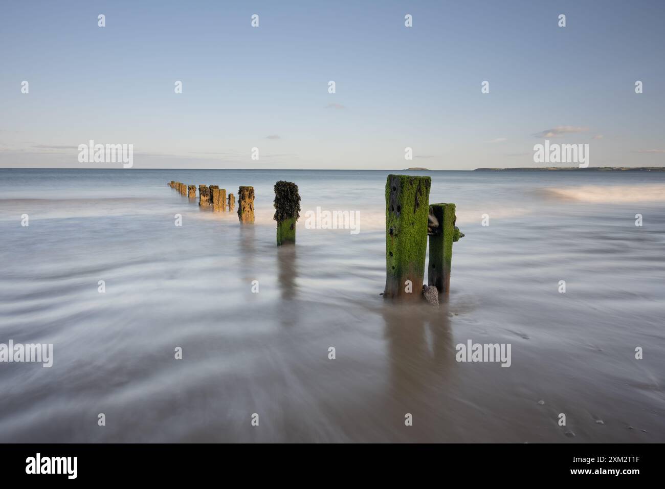 Youghal Strand Groynes on a warm summer evening 2 Stock Photo - Alamy
