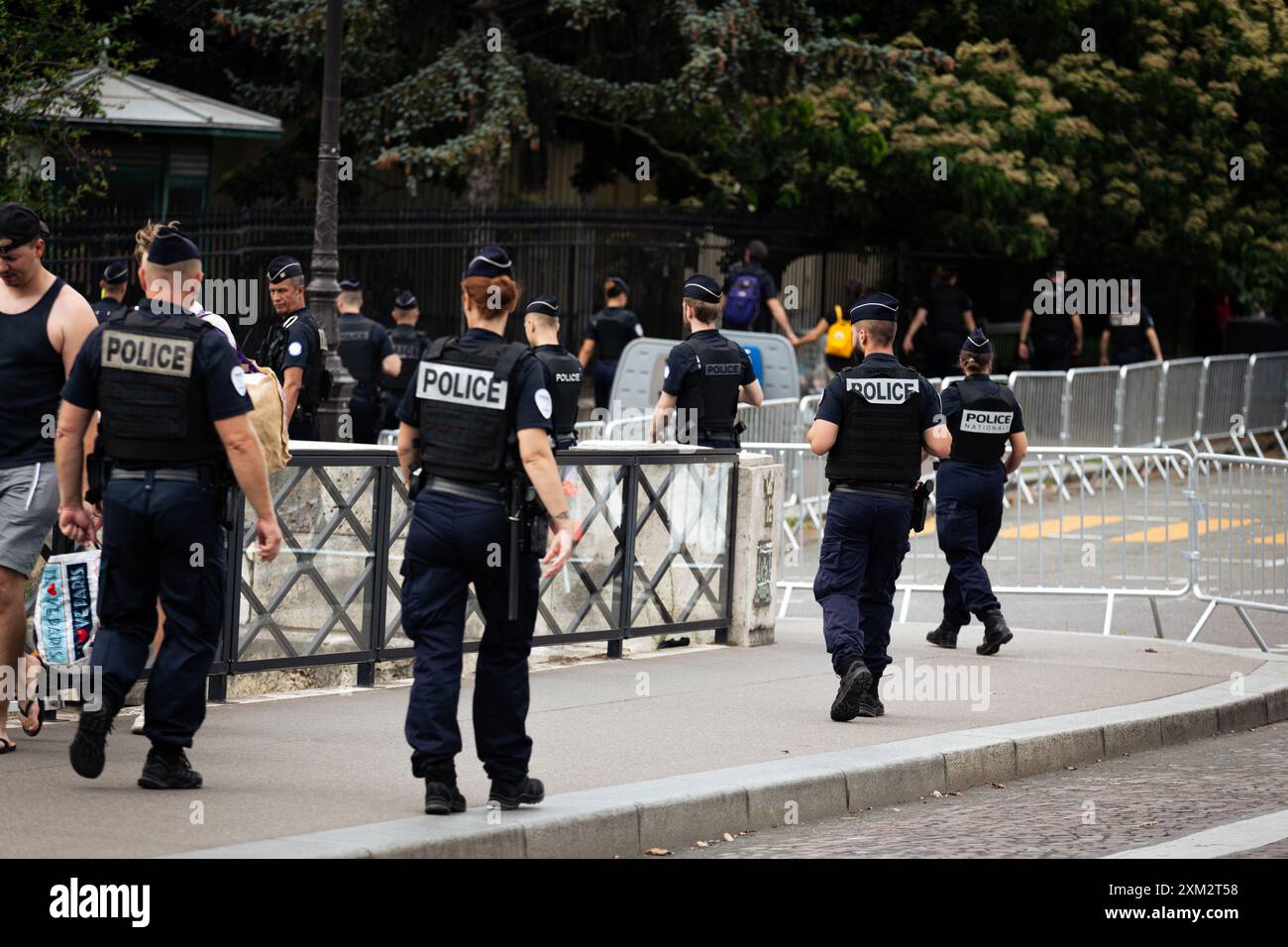 Paris, France. 23rd July, 2024. A police squad patrols the streets near ...