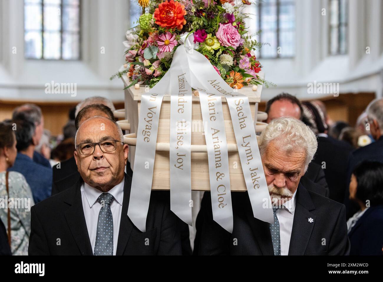 THE HAGUE - Relatives carry the coffin outside during the farewell of ...