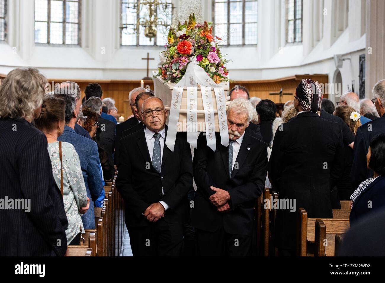 THE HAGUE - Relatives carry the coffin outside during the farewell of ...
