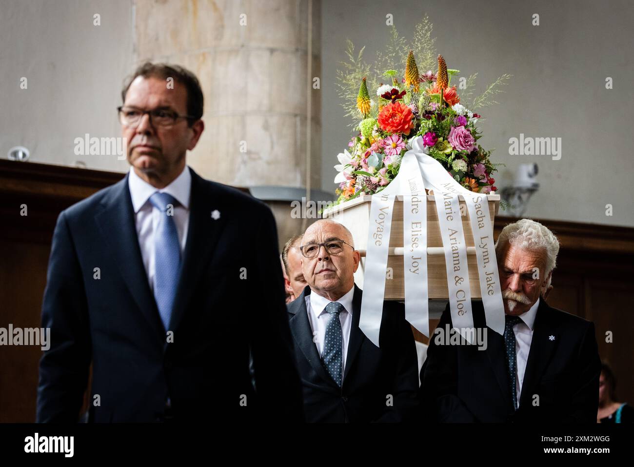 THE HAGUE - Relatives carry the coffin outside during the farewell of ...