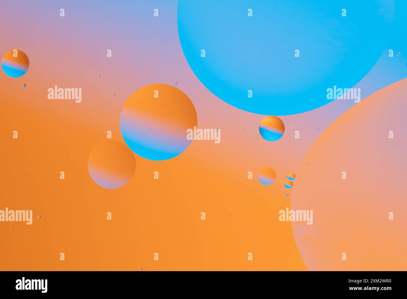 Large circles in orange and blue gradient Stock Photo - Alamy