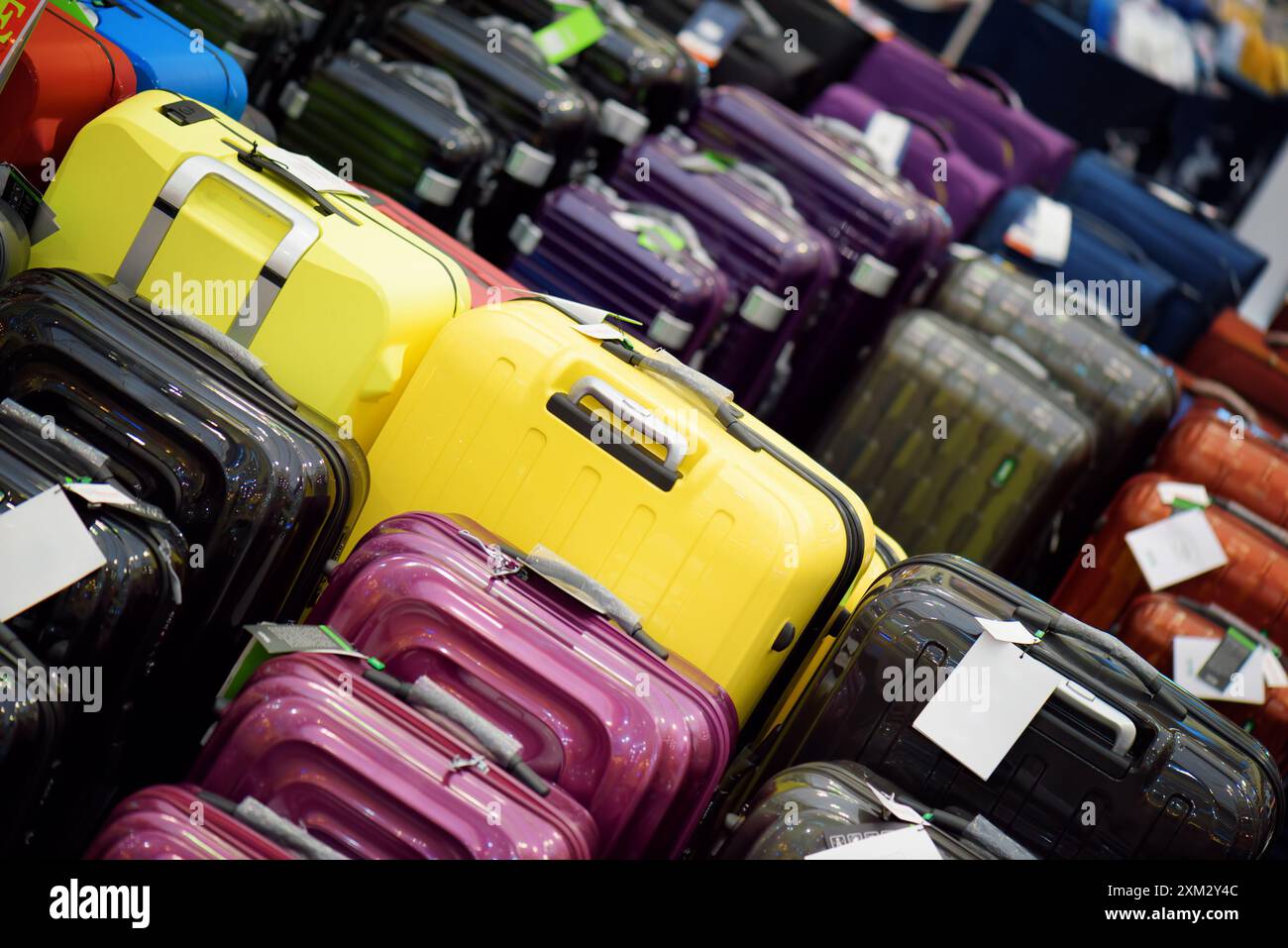 Sale of suitcases of different sizes and colors Stock Photo - Alamy