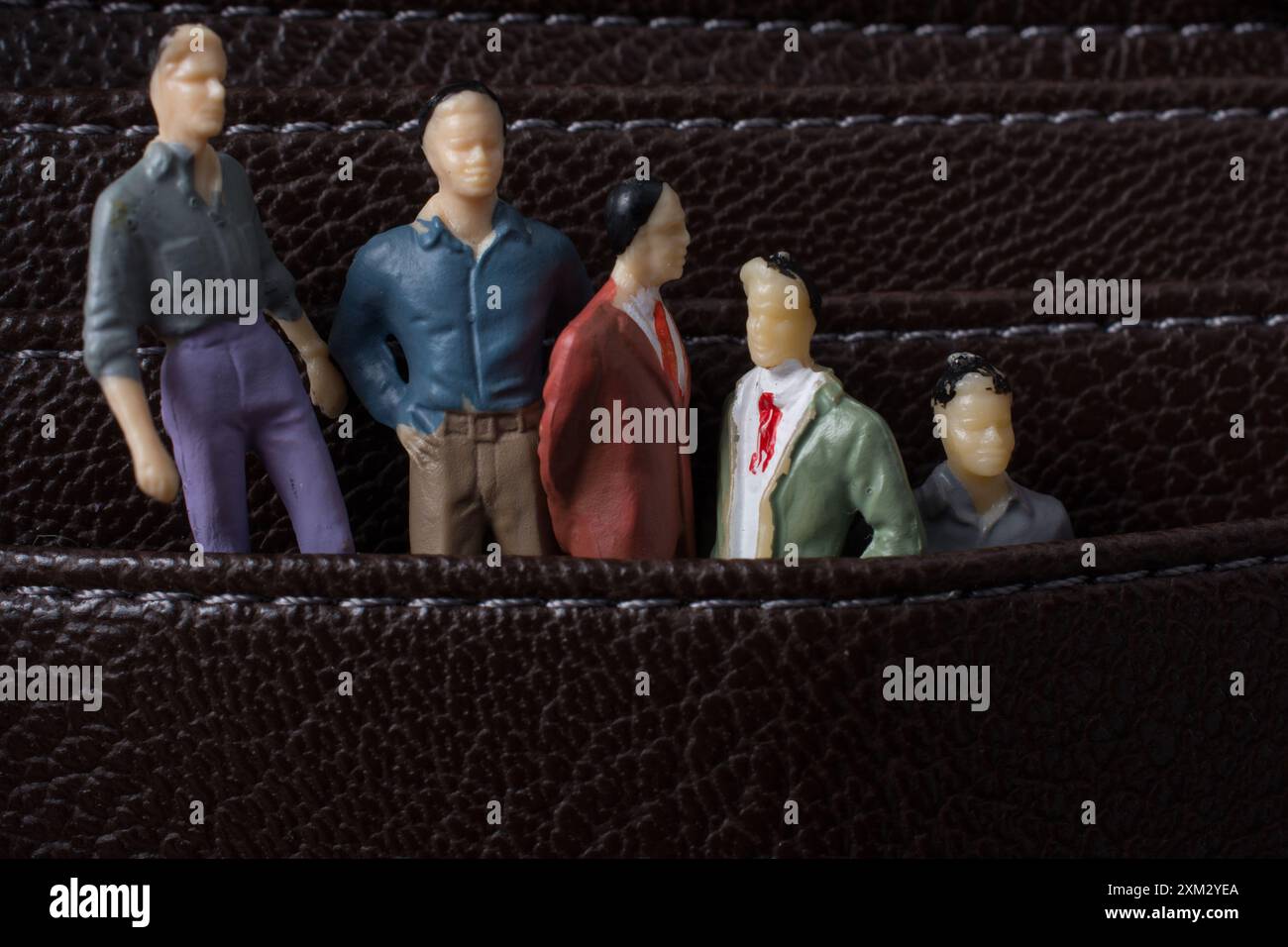 Tiny figurine of group of men miniature model in pockets Stock Photo ...
