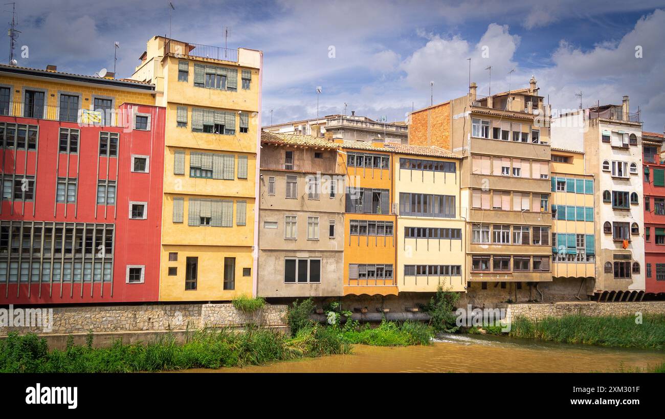 The colorful buildings along the Onyar River in Girona, Spain Stock ...