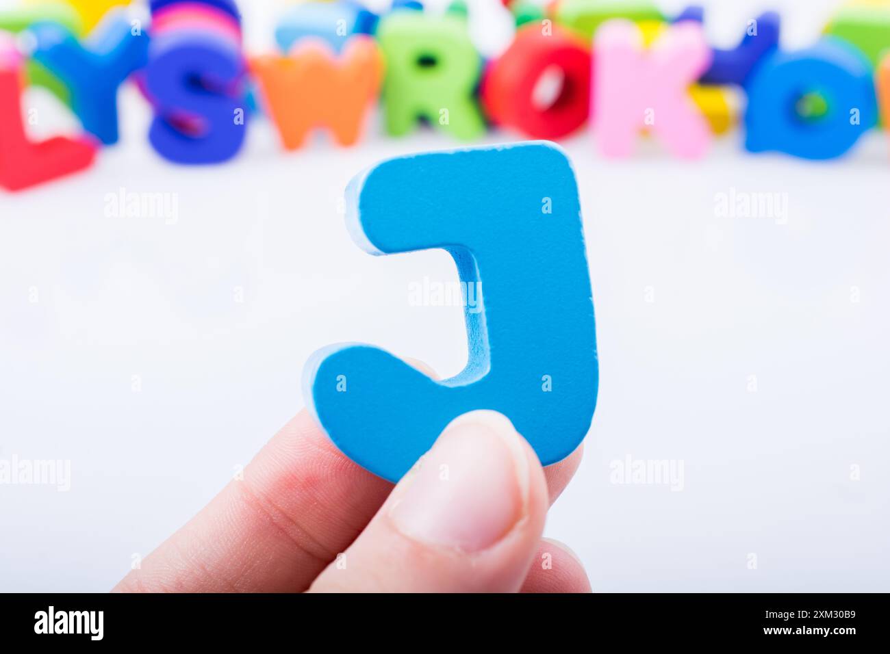 Letter cube of J of Alphabet made of wood Stock Photo - Alamy