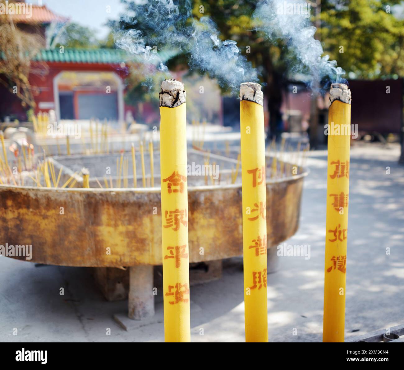 Burning incense sticks on background of the main entrance to the Stock ...