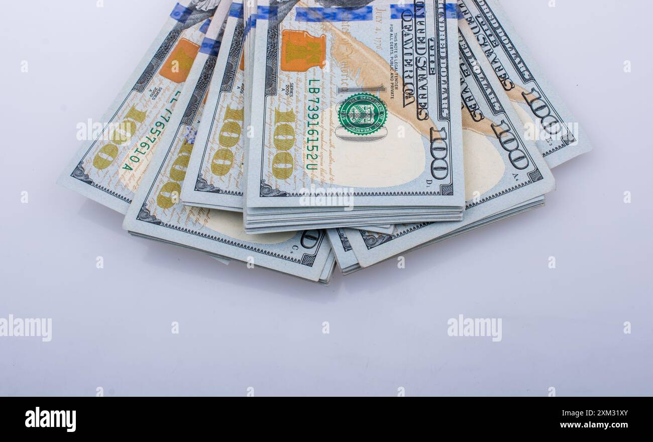 American 100 dollar banknote bundles placed on white background Stock ...