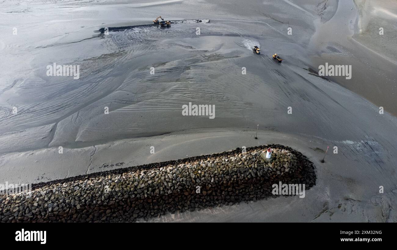 Aerial photograph of lorries carrying out desilting work on the the ...