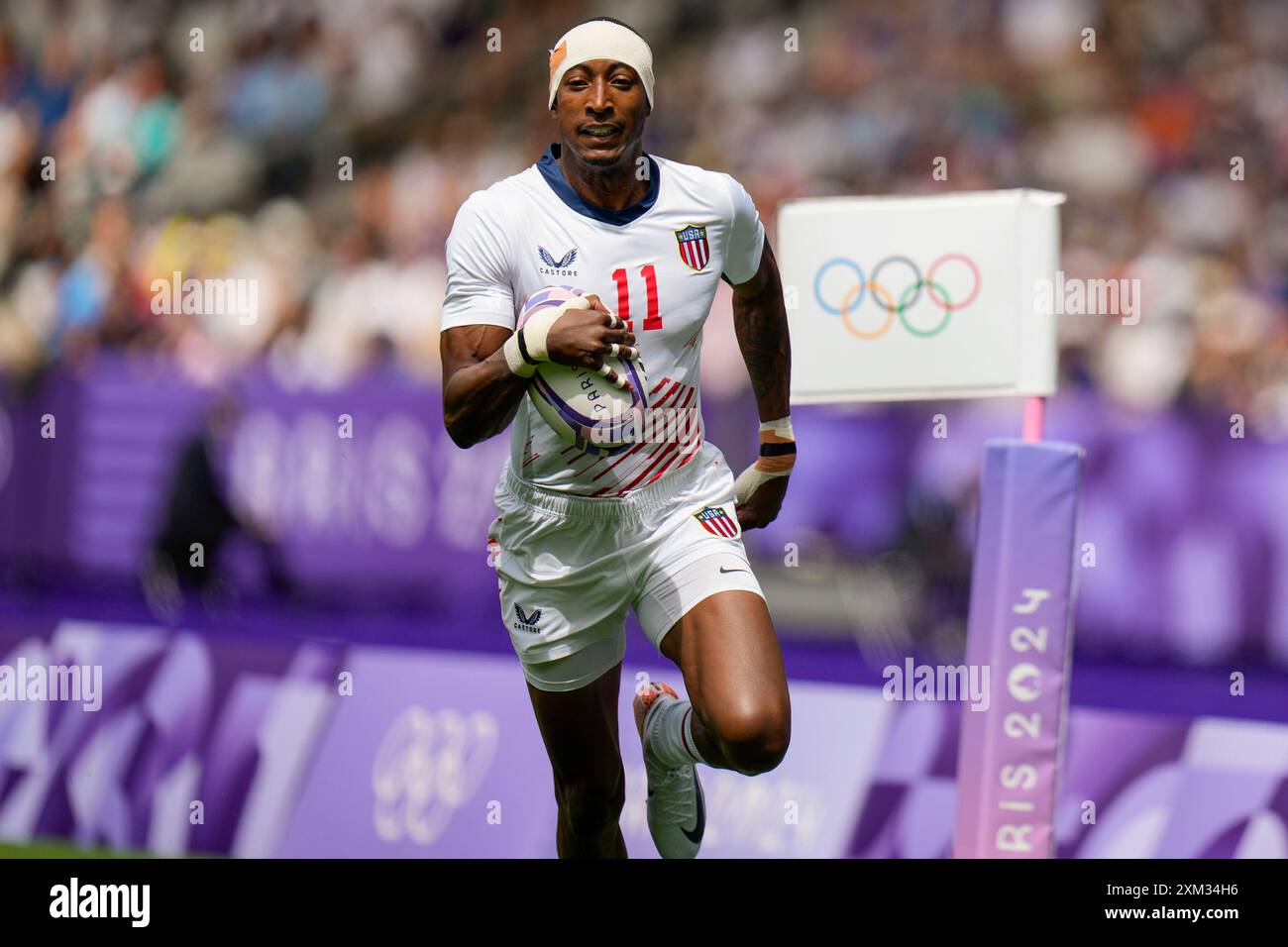 Perry Baker of Team USA runs in to score a try during their men's Pool ...