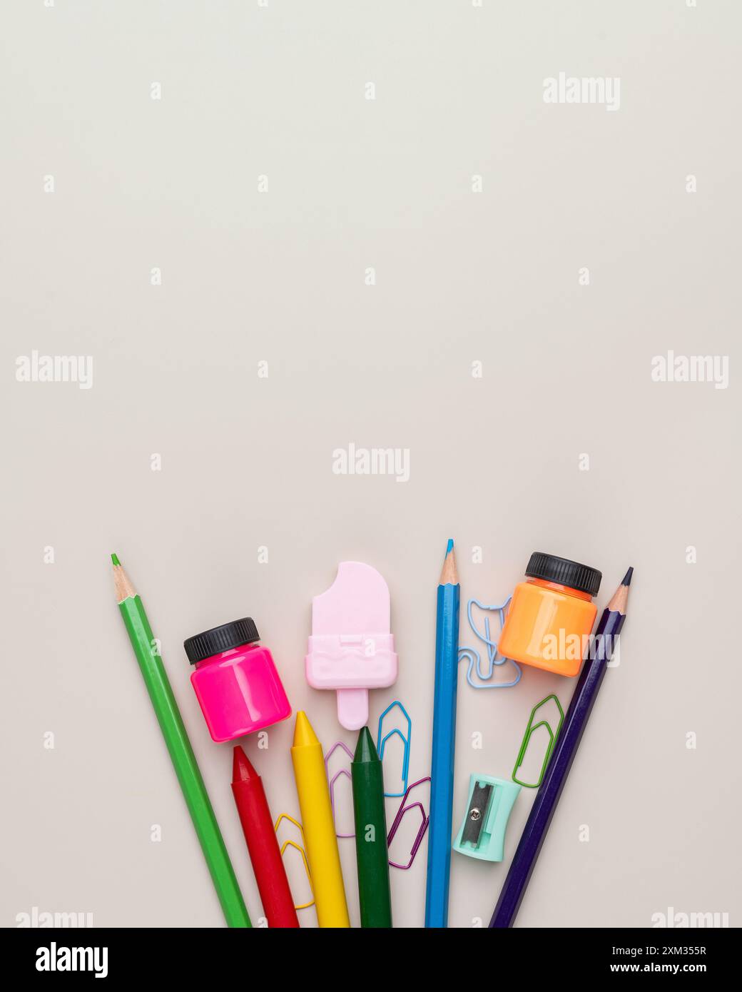 Back to school backdrop. School supply over light brown background with ...