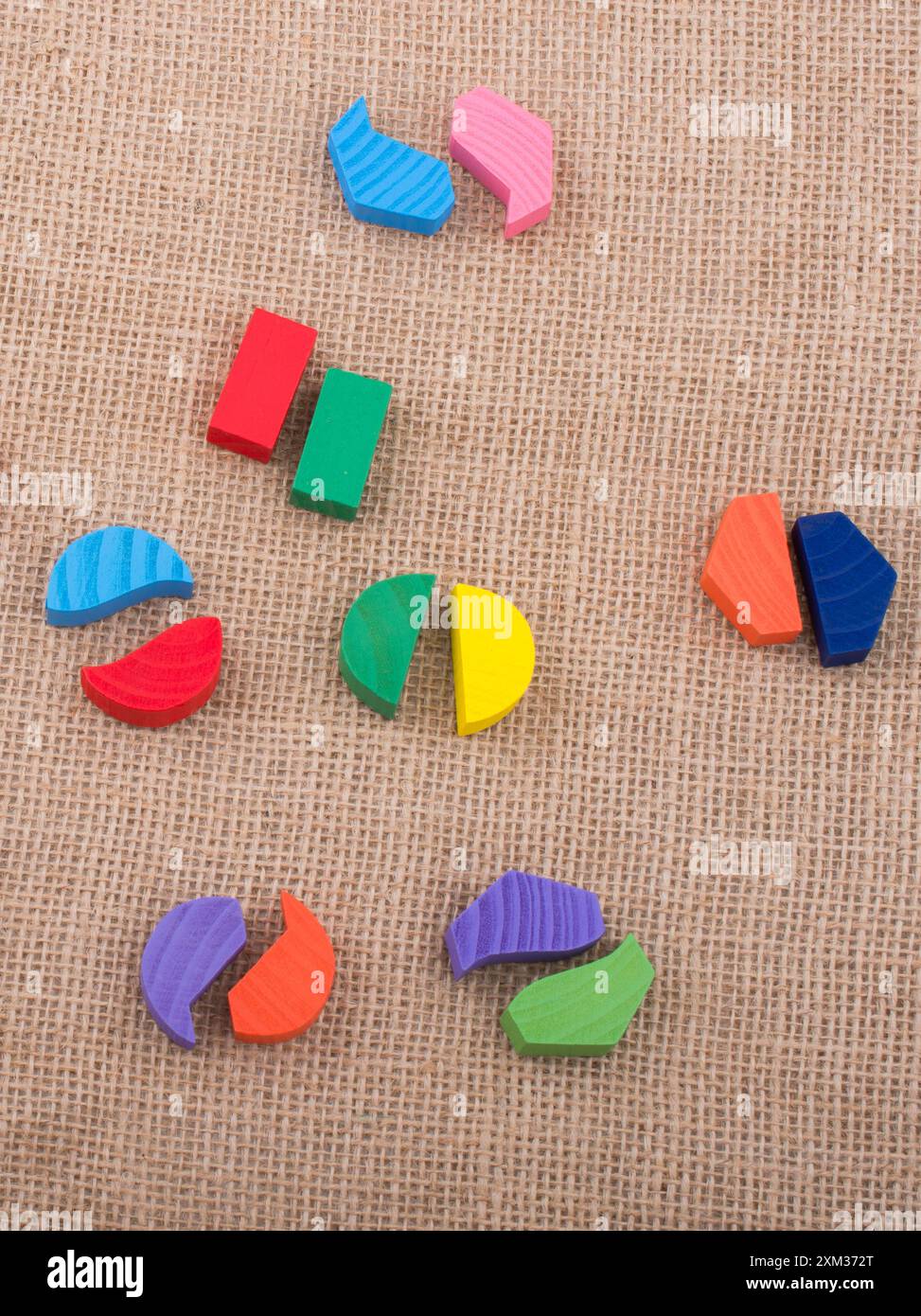 Colorful wooden pieces of a logic puzzle Stock Photo - Alamy