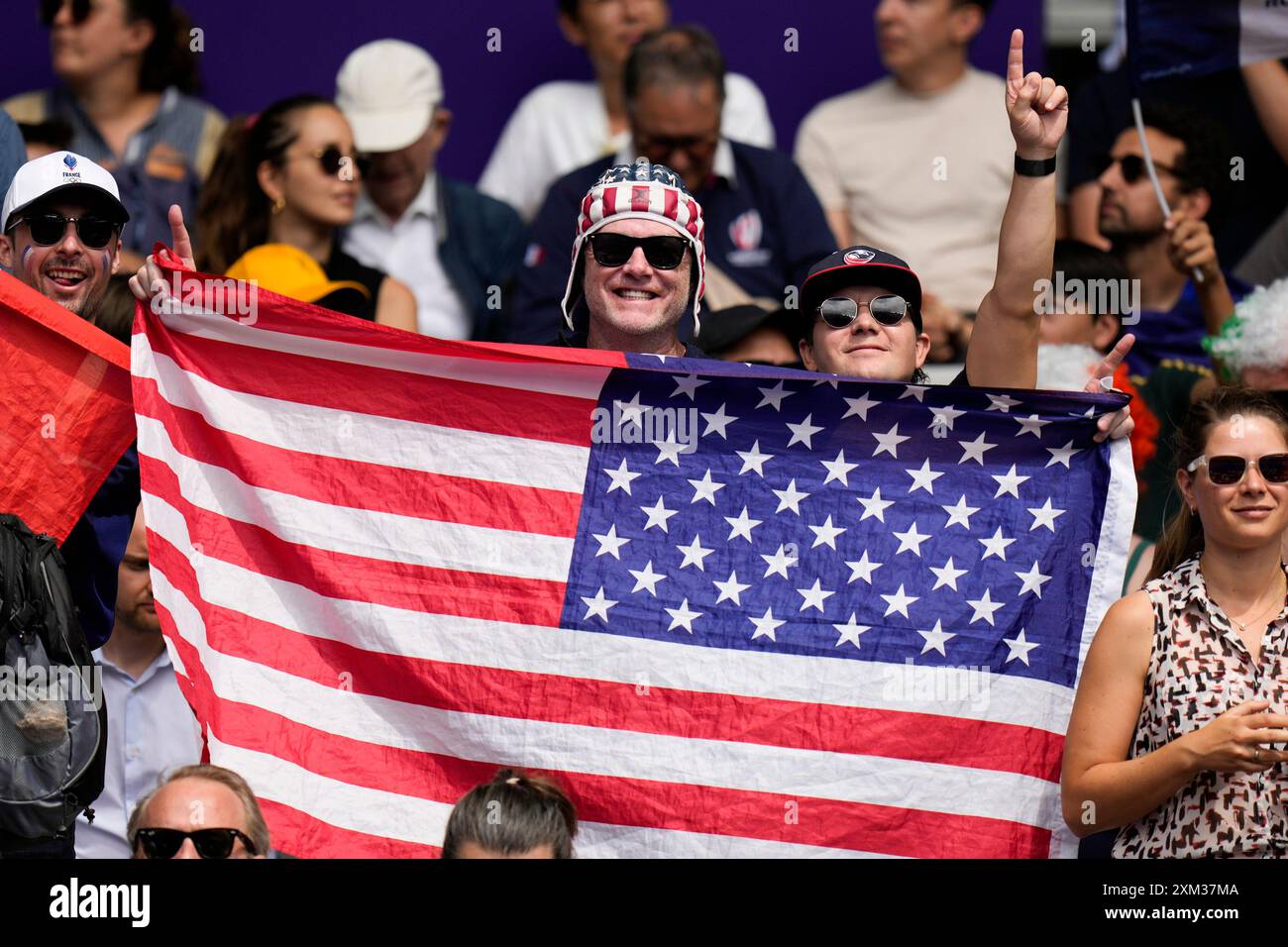 Team USA rugby supporters hold up the U.S. flag during their men's Pool ...