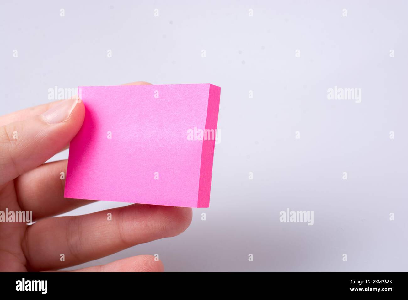 Post note office sticker for taking notes in hand Stock Photo - Alamy