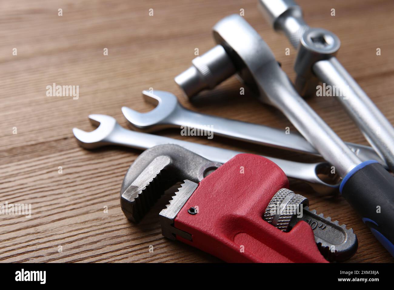 Different auto mechanic's tools on wooden table, closeup Stock Photo ...