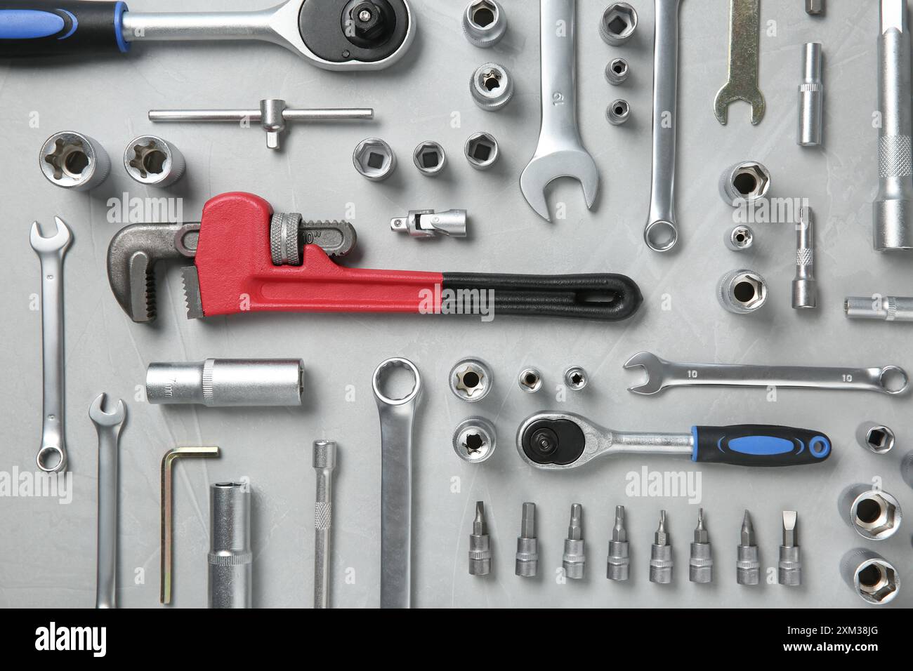 Different auto mechanic's tools on grey table, flat lay Stock Photo - Alamy