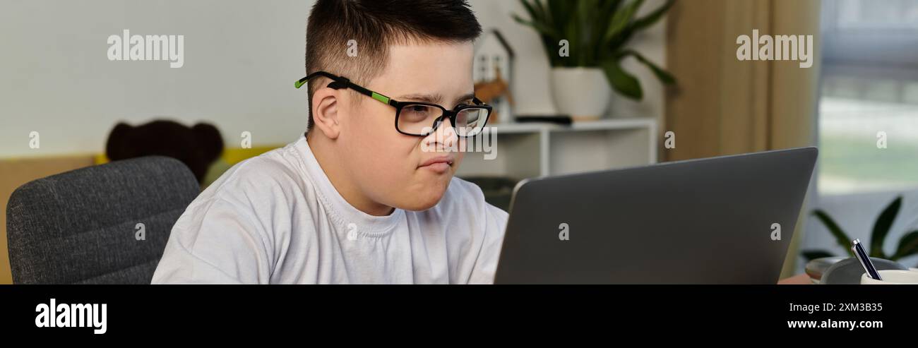 Down syndrome student laptop hi-res stock photography and images - Alamy