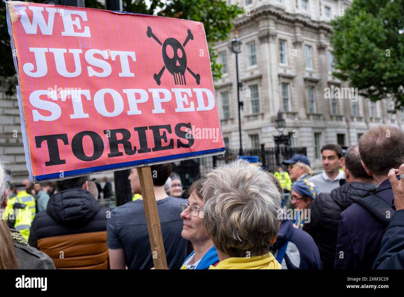Protesters gather outside Downing Street on the day that the outgoing ...