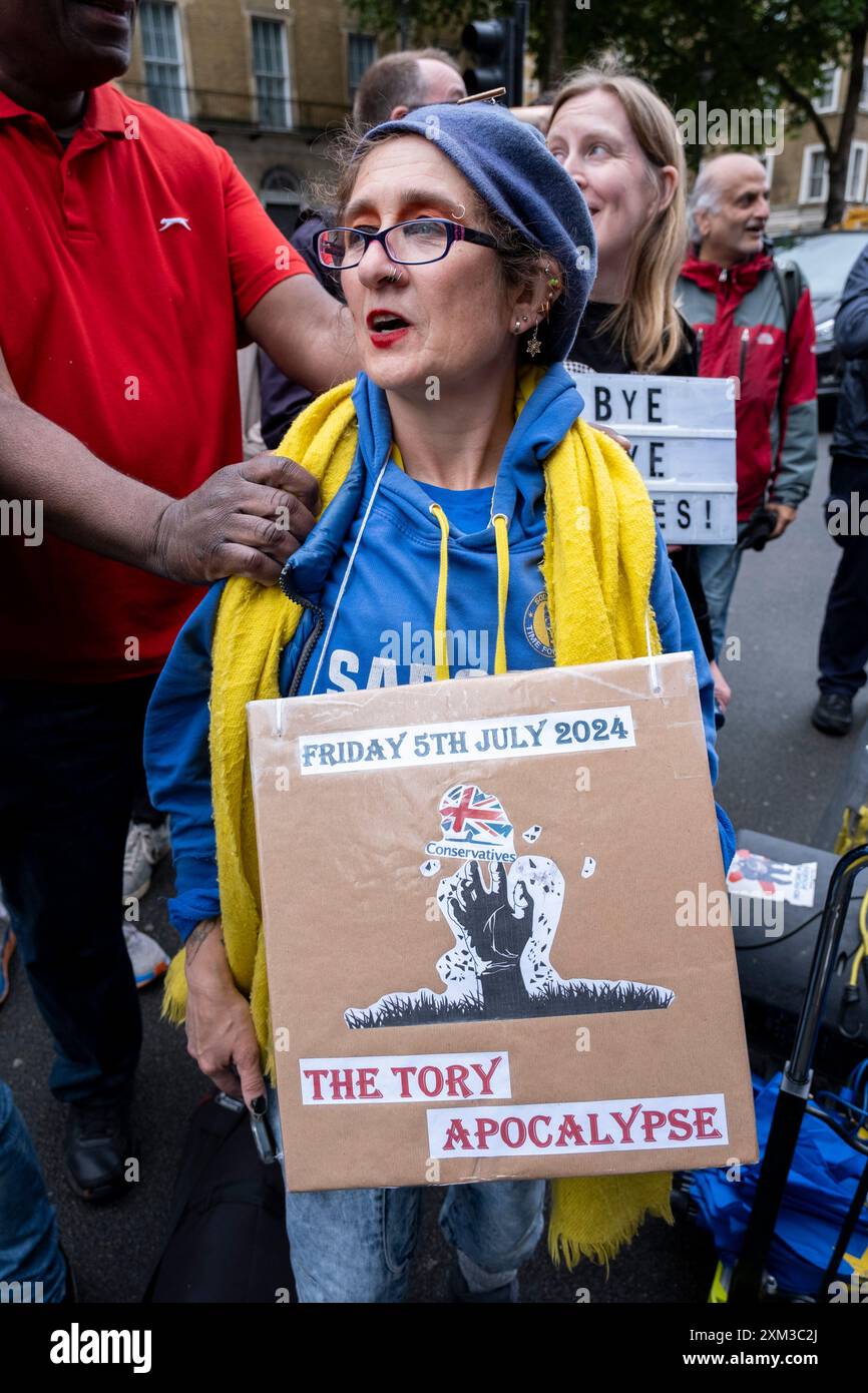 Protesters gather outside Downing Street on the day that the outgoing ...