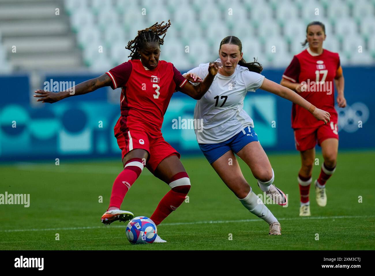 Canada's Kadeisha Buchanan, left, and New Zealand's Milly Clegg compete ...