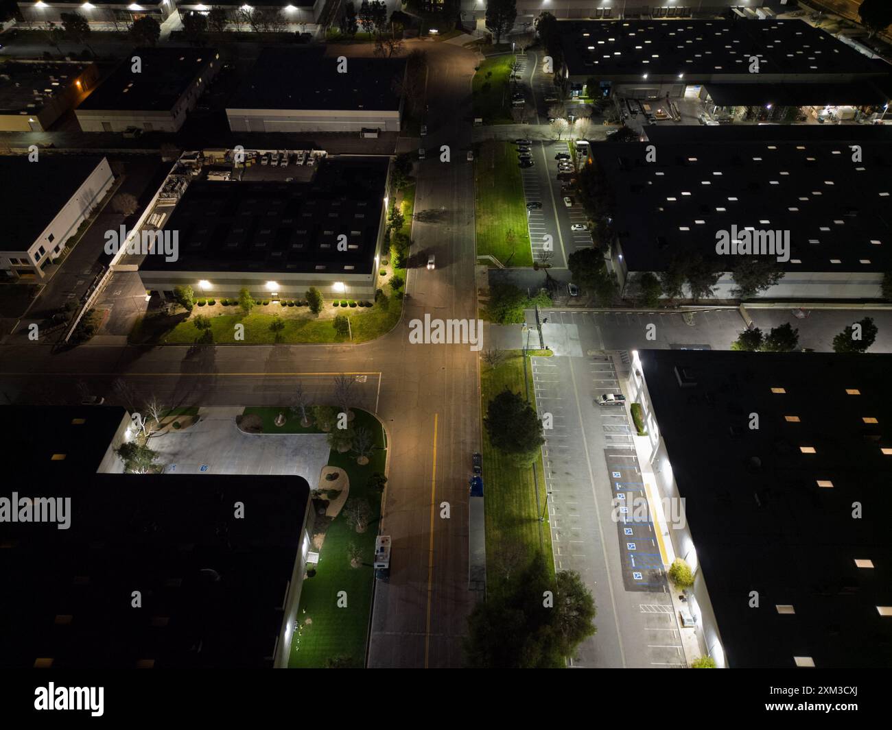 Several warehouse buildings in an industrial park are shown from an ...