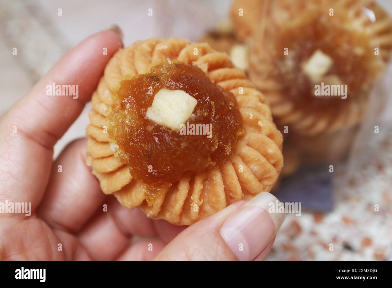 Hand Holding an Open-faced Kuih Tart, a Mini Pineapple Jam Tart Popular ...