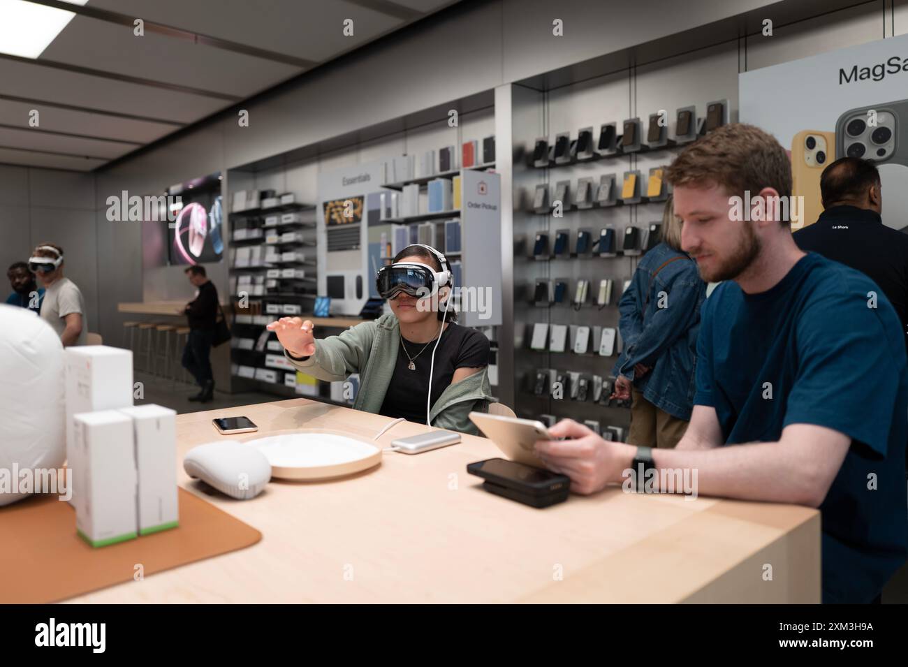 Cambridge UK Apple Store July 2024 Customer tries out a Apple Vision ...