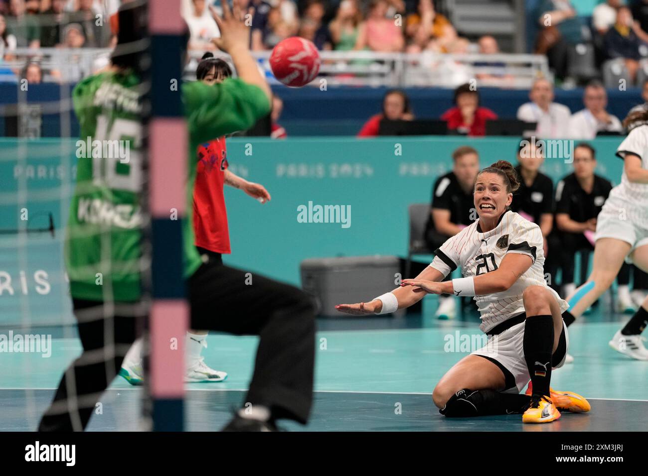 Emily Boelk, right, of Germany, tries to shoot the ball against ...