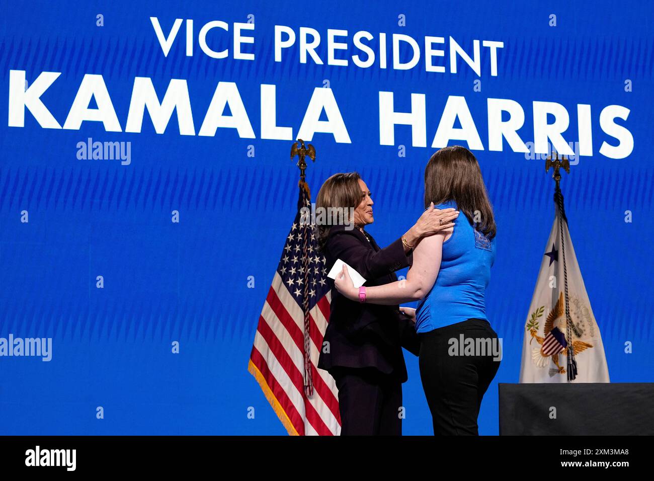 Vice President Kamala Harris is introduced by Brittany Shoup, right ...